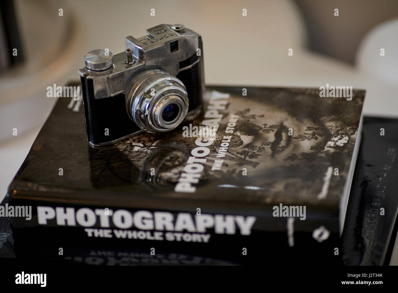 Photography books and classic camera ornament Stock Photo - Alamy