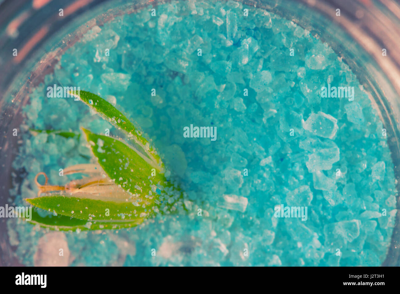 Spa blue sprinkled salt texture in a bottle Stock Photo - Alamy