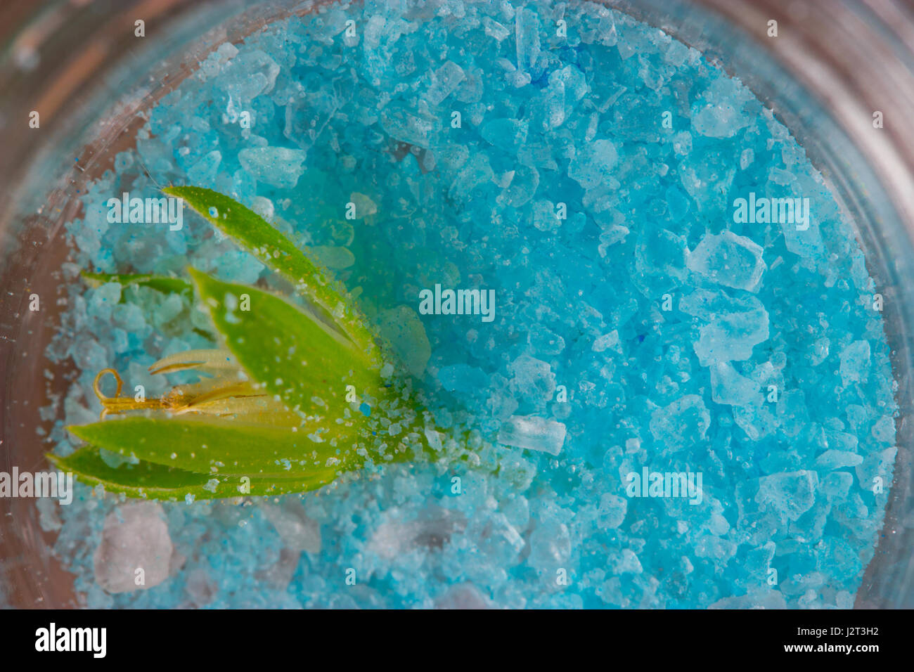 Spa blue sprinkled salt texture in a bottle Stock Photo - Alamy