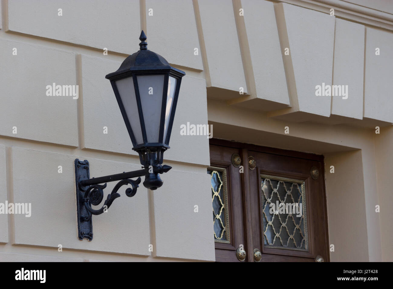 old style lantern on a building wall Stock Photo - Alamy