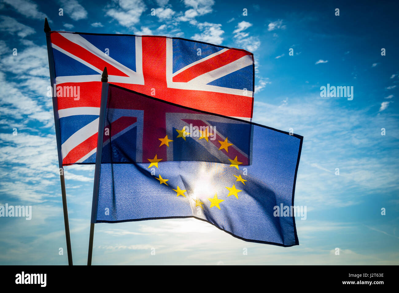 EU European Union and UK United Kingdom flags flying together in bright ...