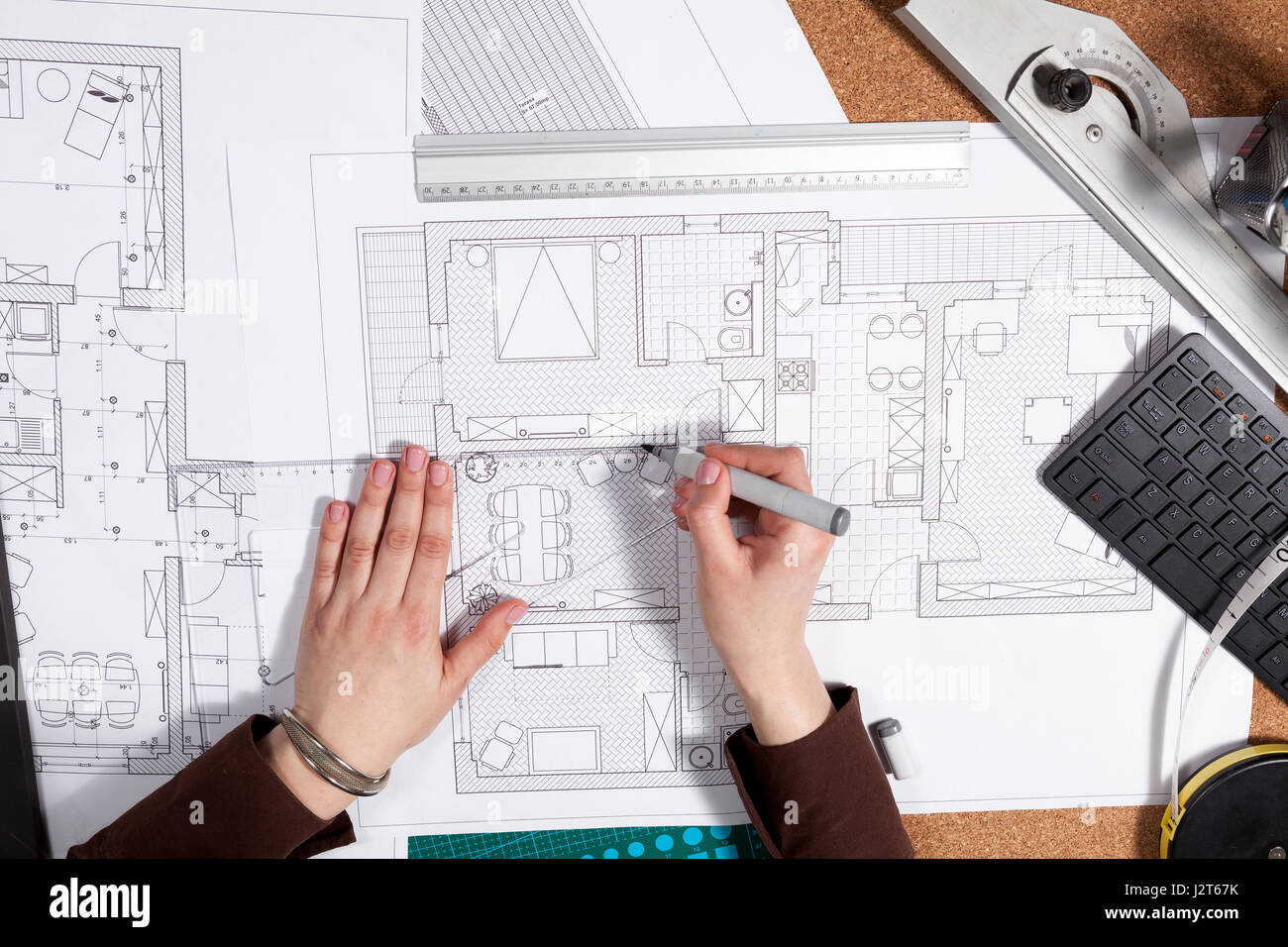 Close up of architect desk with blueprints Stock Photo - Alamy