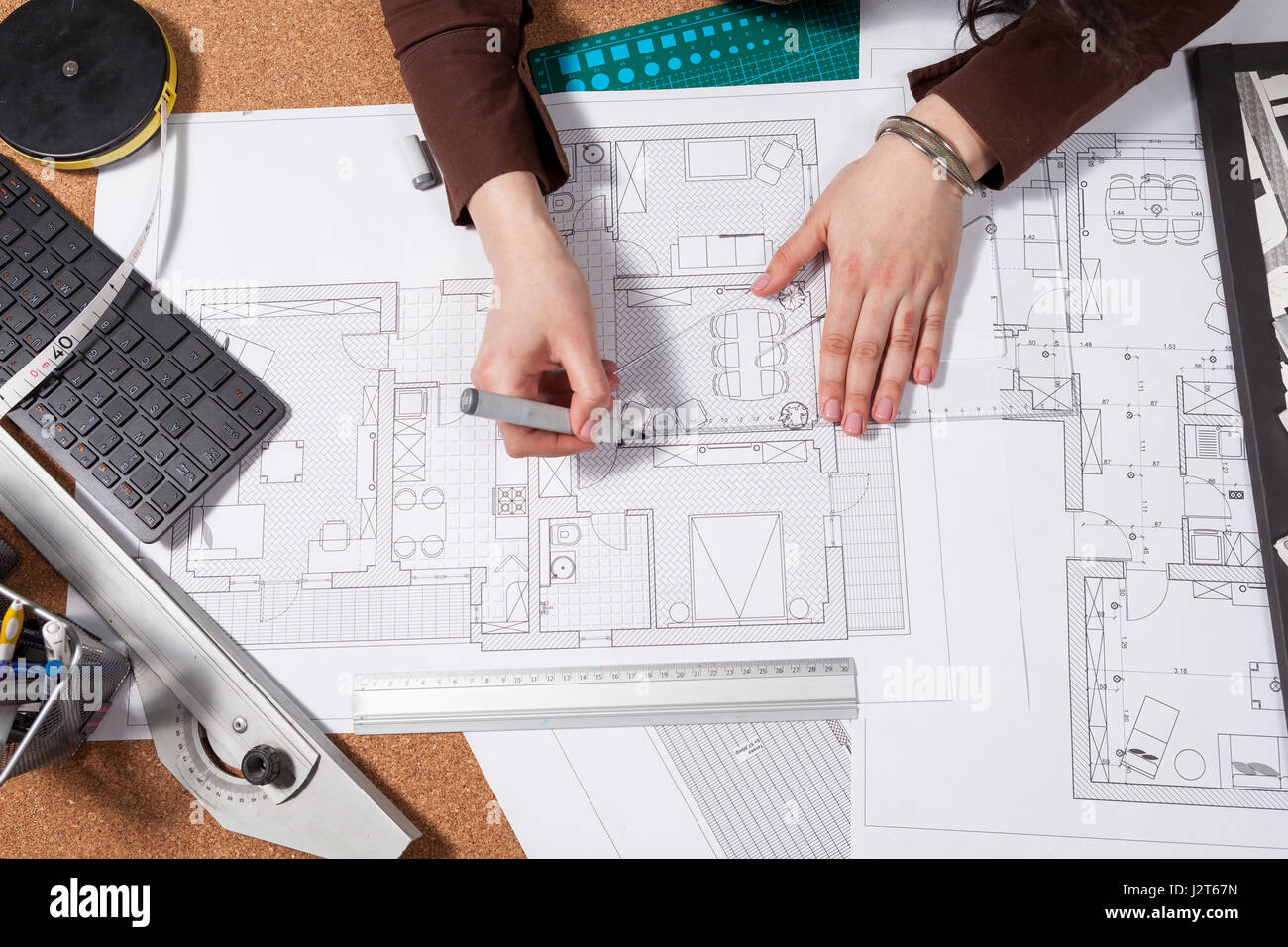 Close up of architect desk with blueprints Stock Photo - Alamy