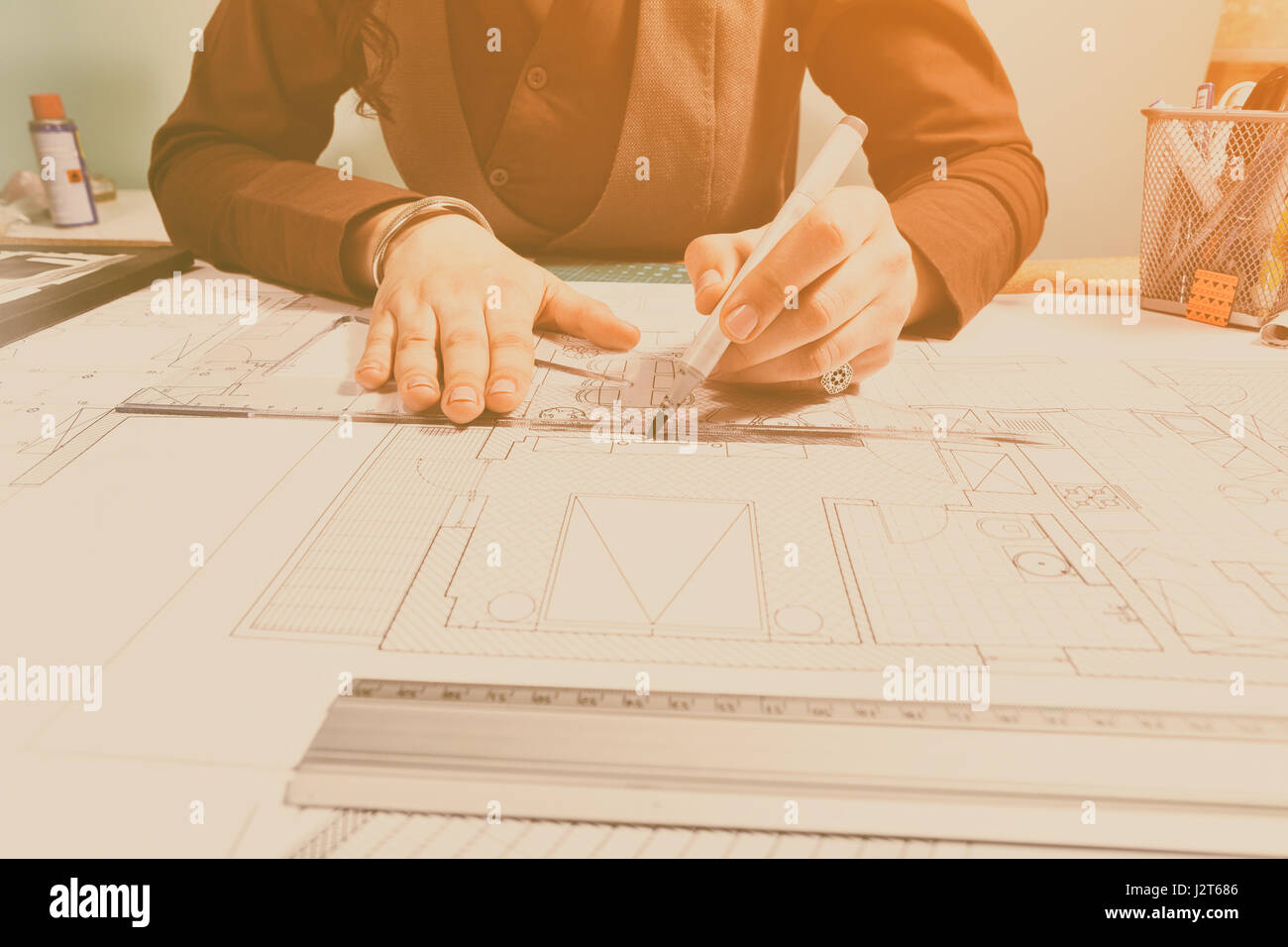 Close up of architect hands working on blueprints Stock Photo - Alamy