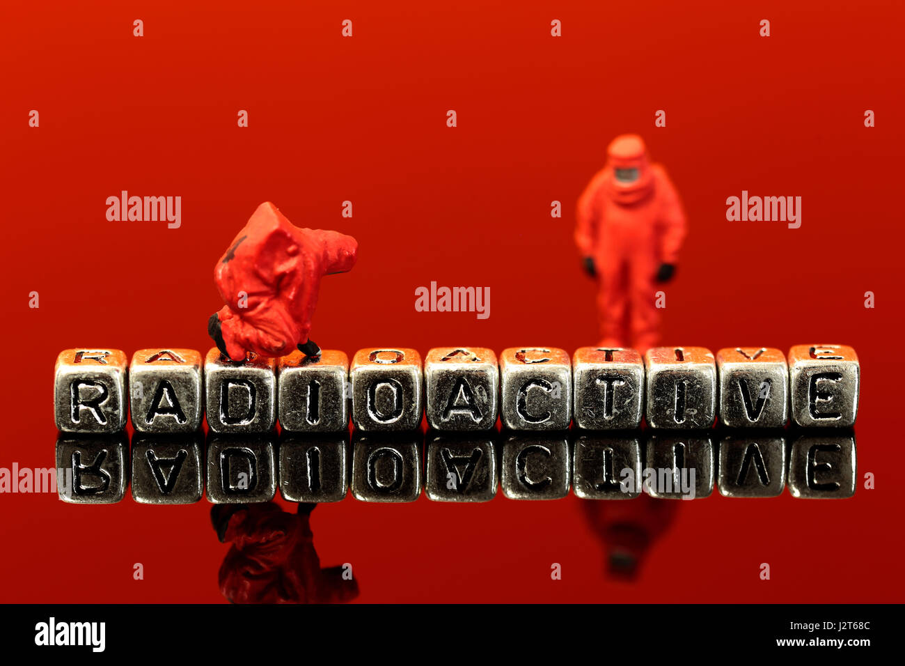 Miniature scale model team in chemical suits with the word radioactive ...