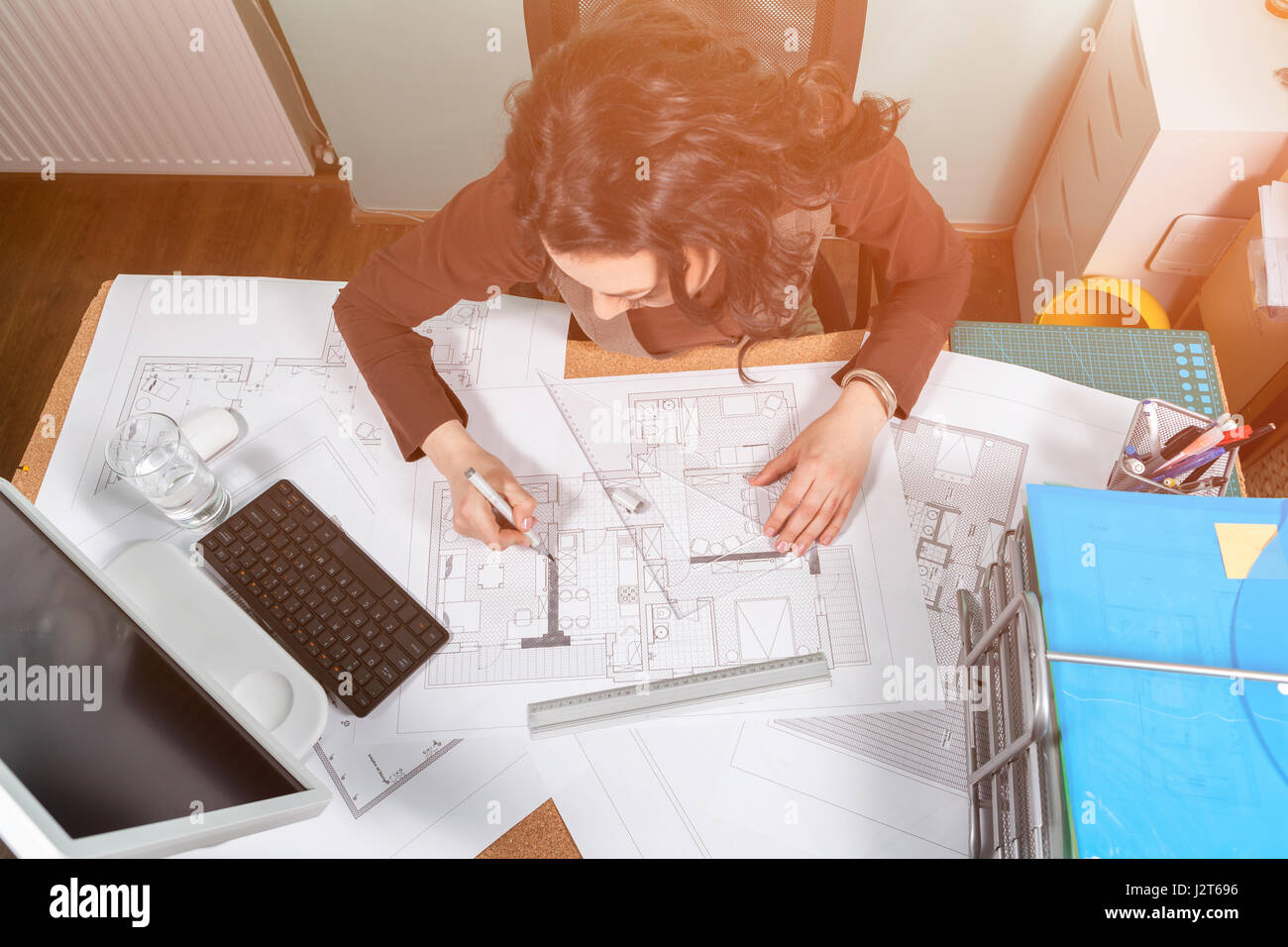 Architect at her office in work process Stock Photo - Alamy