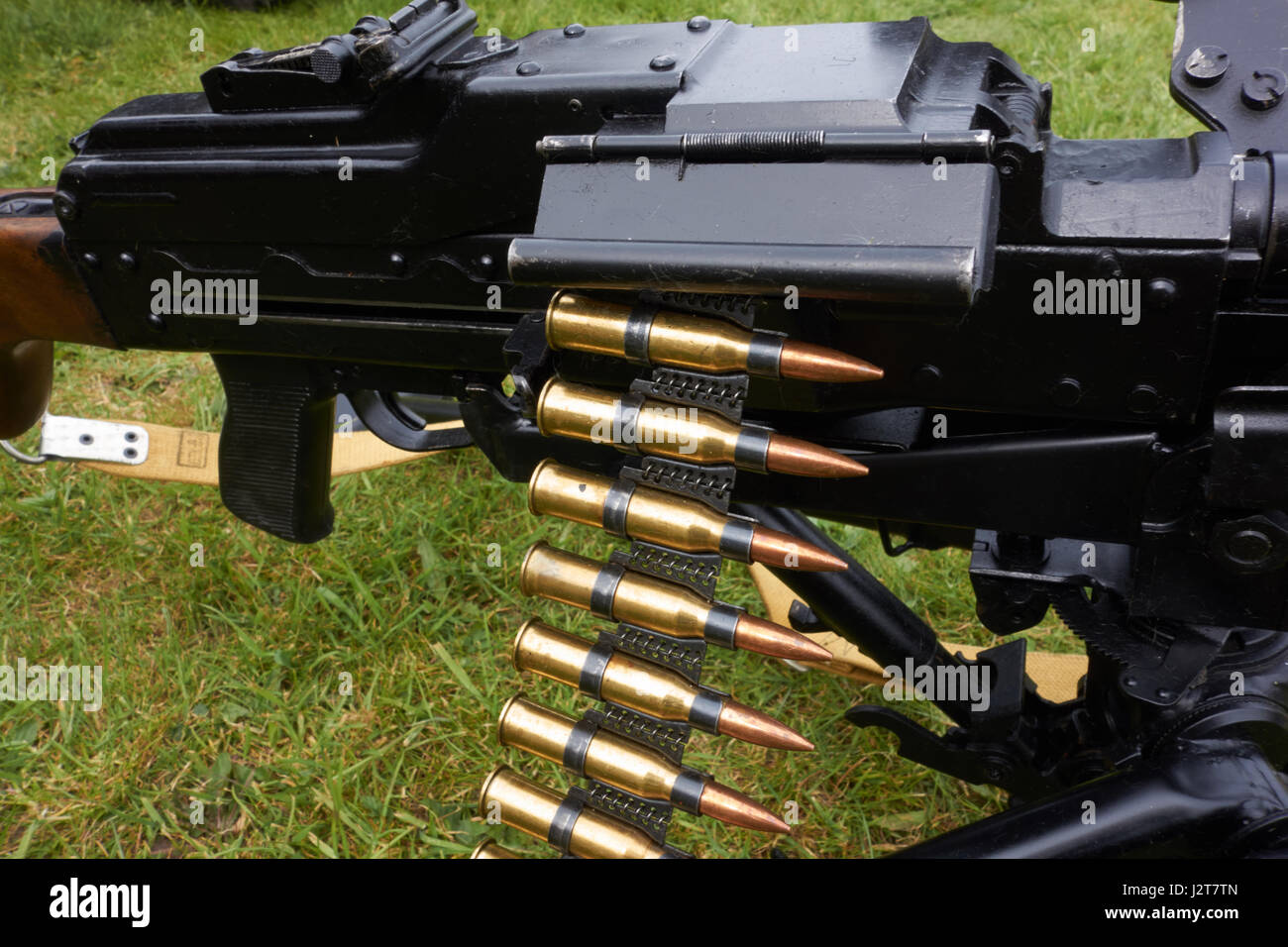 Closeup of belt of bullets and machine gun Stock Photo - Alamy