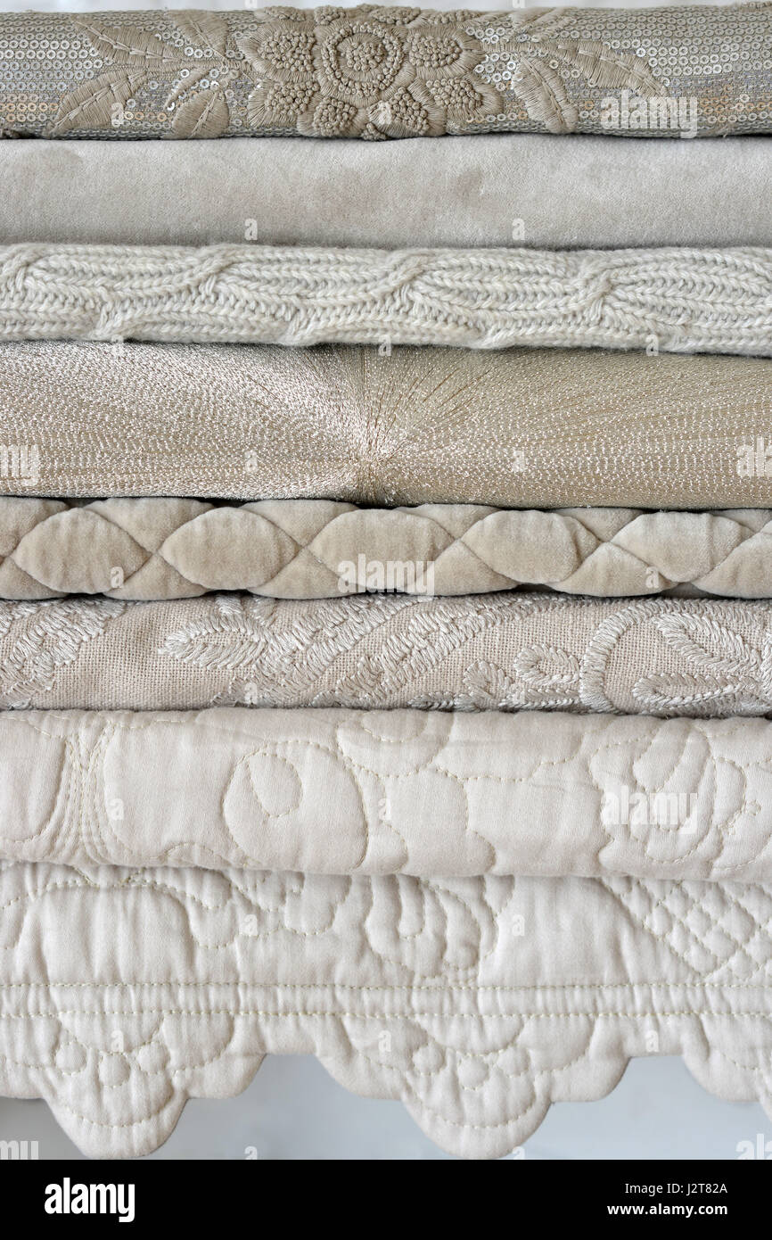 Pile of folded and textured bedding Stock Photo - Alamy