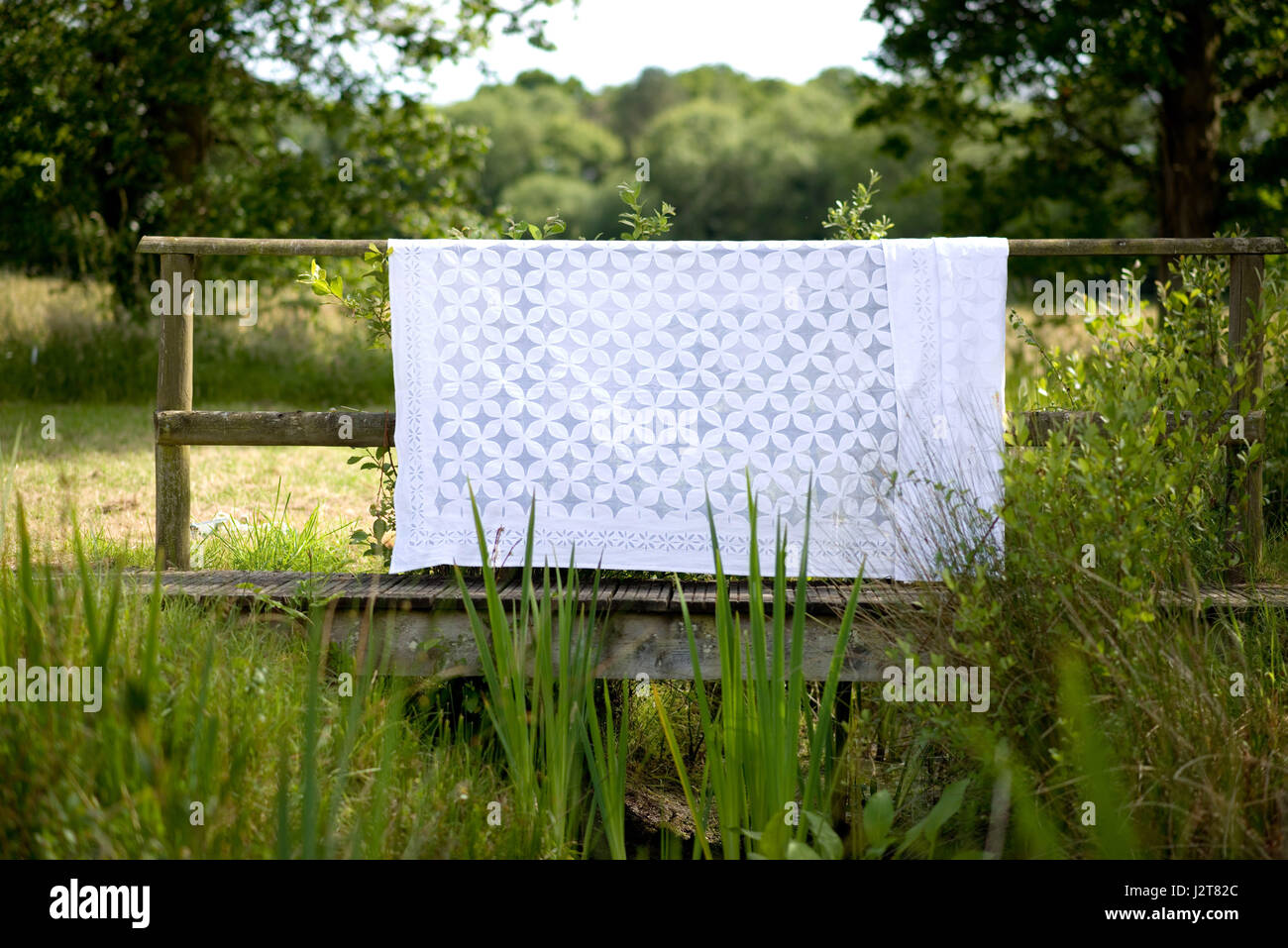White table cloth/throw outside in the wind Stock Photo - Alamy