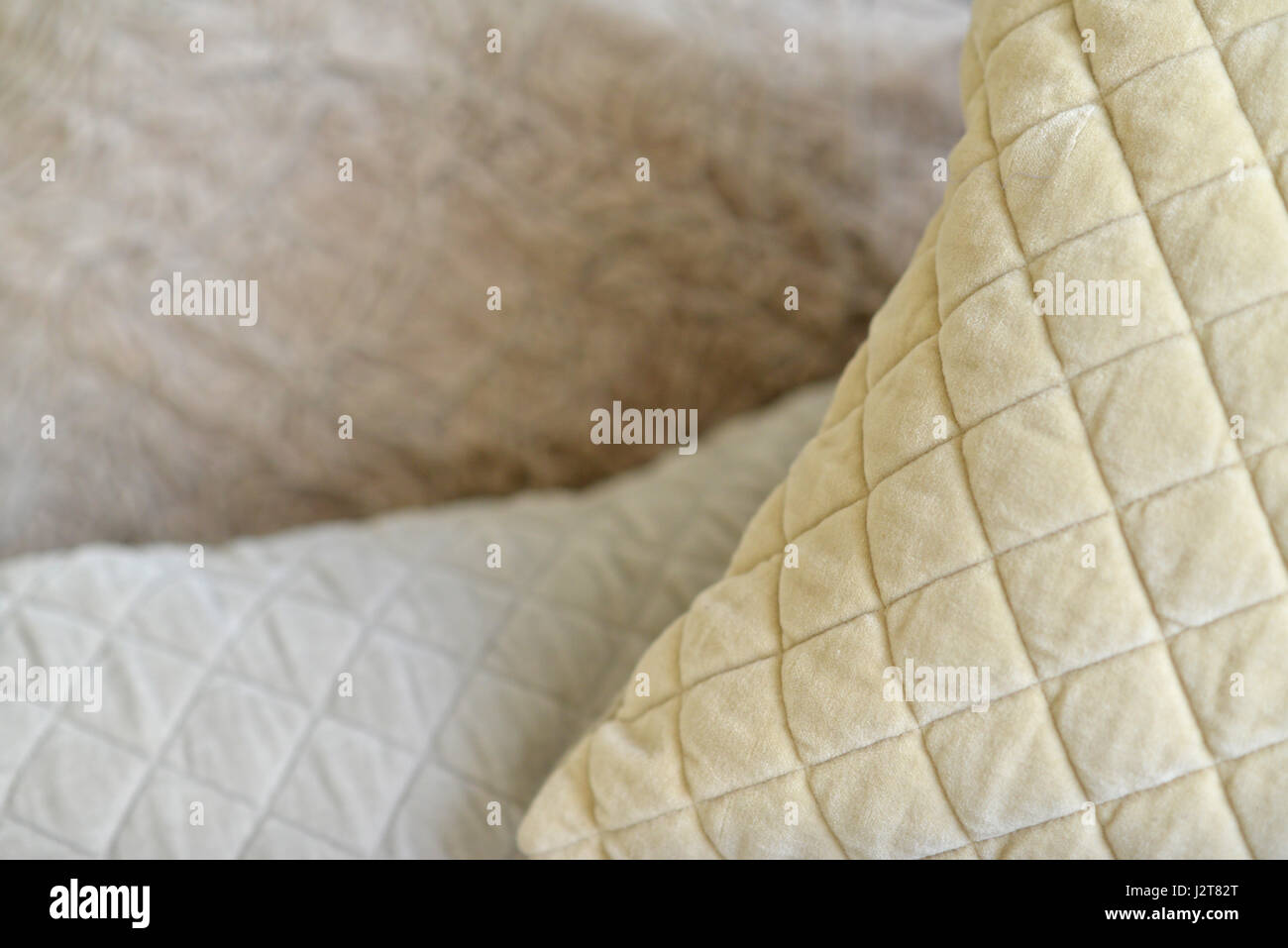 Textured cushions on a couch Stock Photo - Alamy