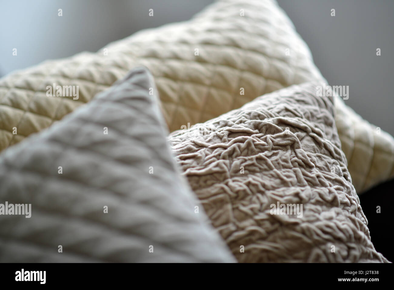 Textured cushions on a couch Stock Photo - Alamy