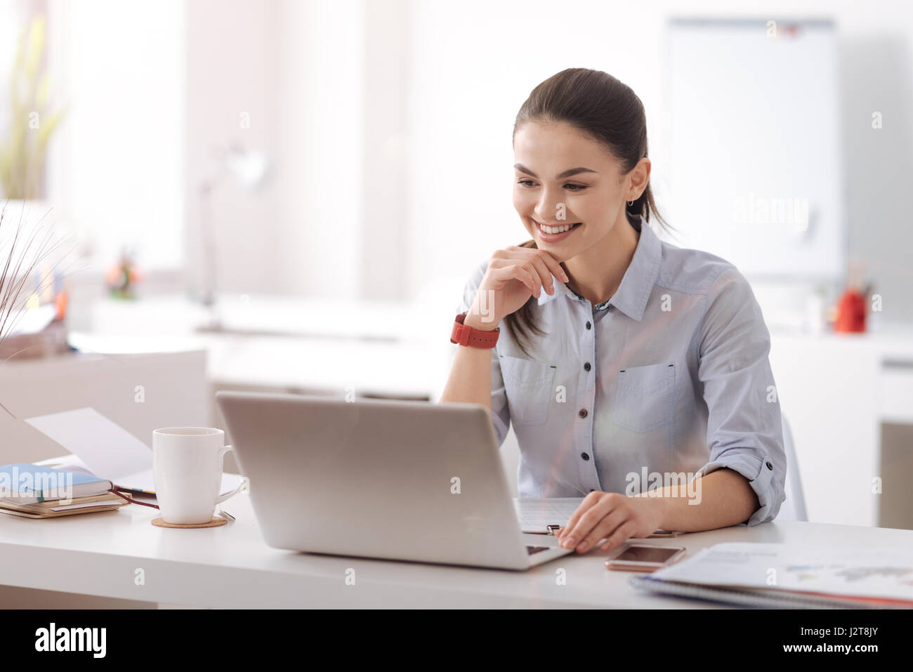 Positive delighted manager feeling happiness Stock Photo - Alamy