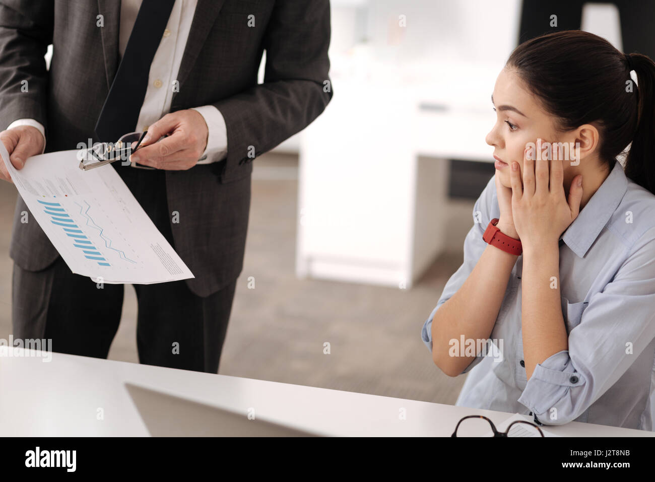 Portrait of frustrated female while being deep in thoughts Stock Photo ...