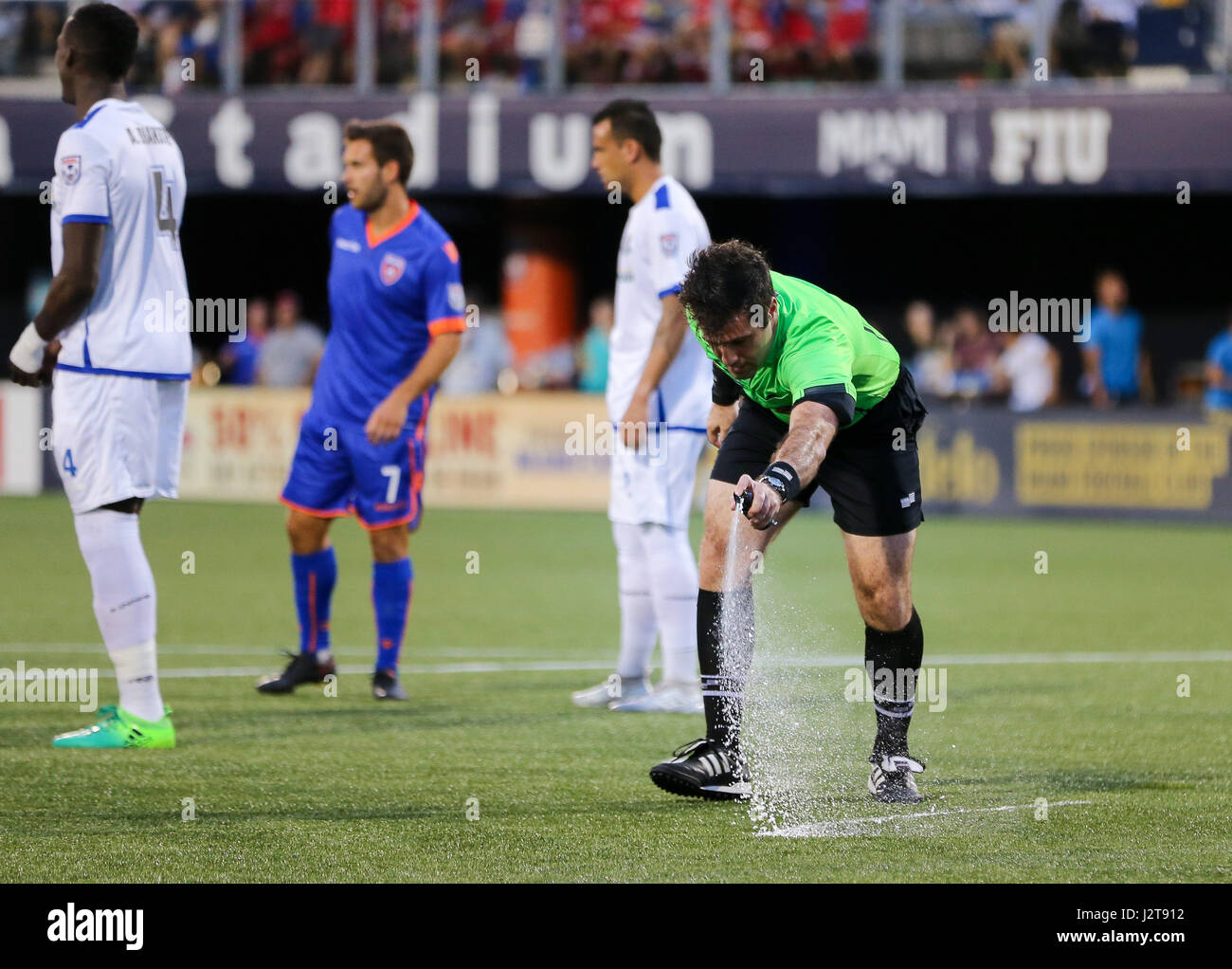 Miami, Florida, USA. 29th Apr, 2017. The game's referee marks the field ...