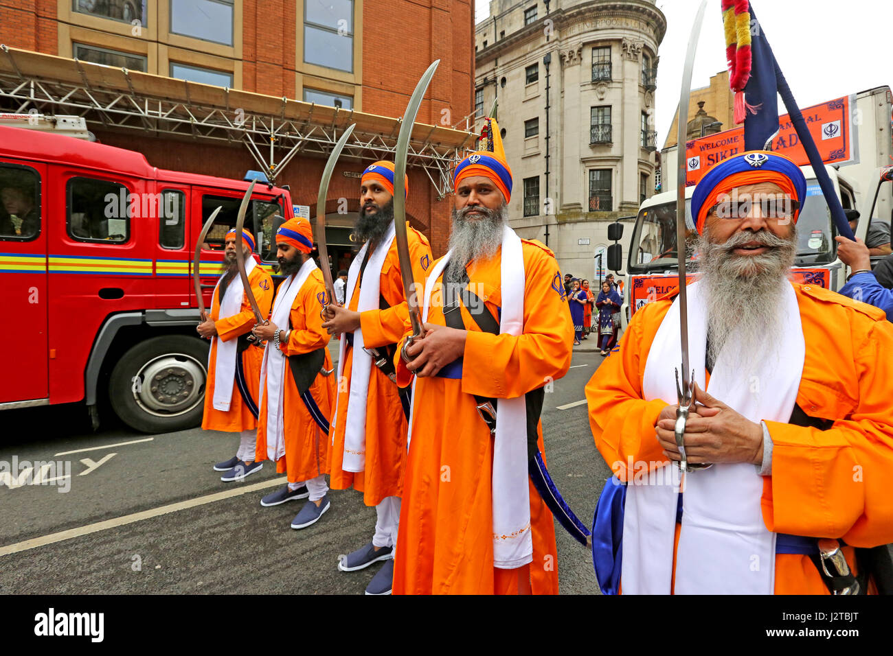 Sikh men swords hi-res stock photography and images - Alamy