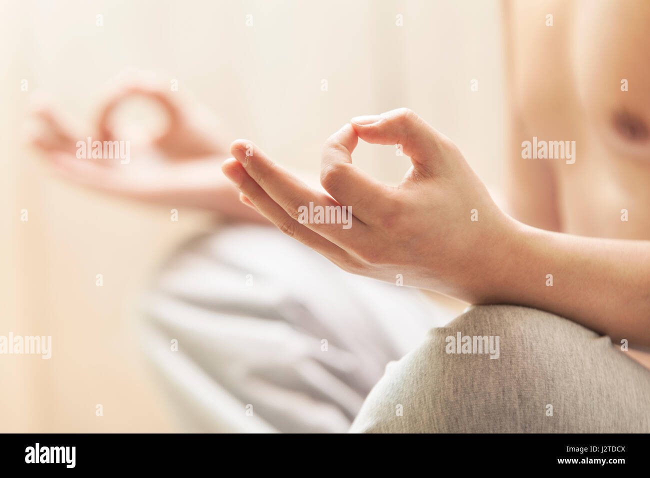 The man in a yoga pose with the hands put on a lap Stock Photo - Alamy