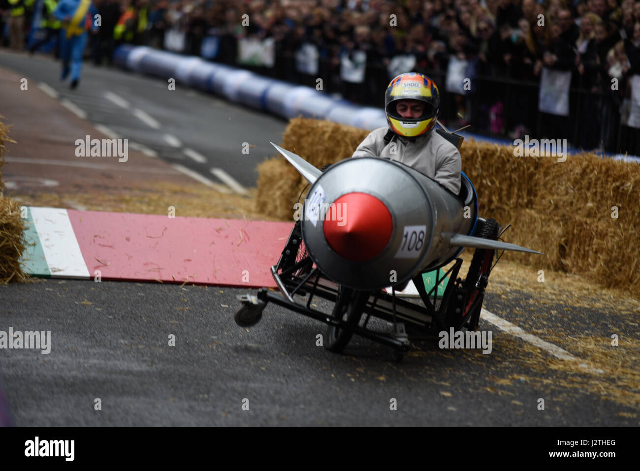 Soapbox, or soap box, derby carts leap over the jump ramps during an ...