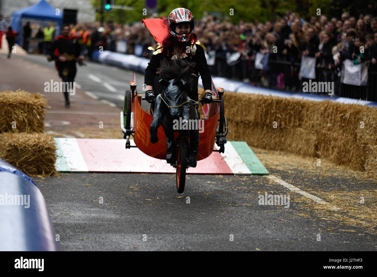 Soapbox, or soap box, derby carts leap over the jump ramps during an ...