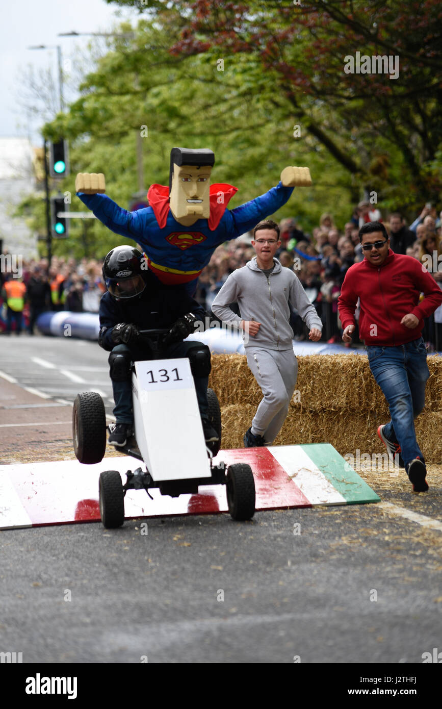 Soapbox, or soap box, derby carts leap over the jump ramps during an ...