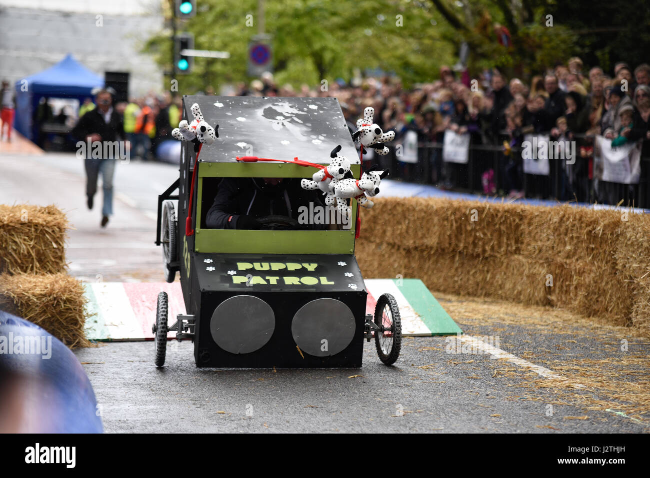 Soapbox, or soap box, derby carts leap over the jump ramps during an ...