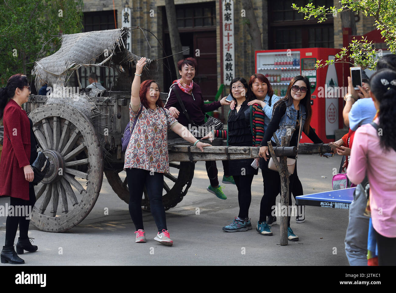Xi'an, China's Shaanxi Province. 1st May, 2017. Tourists pose for group ...