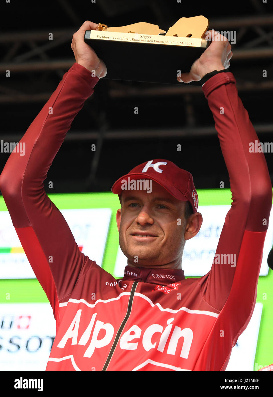 Norway's Alexander Kristoff of the Katusha-Alpecin team holds high his ...
