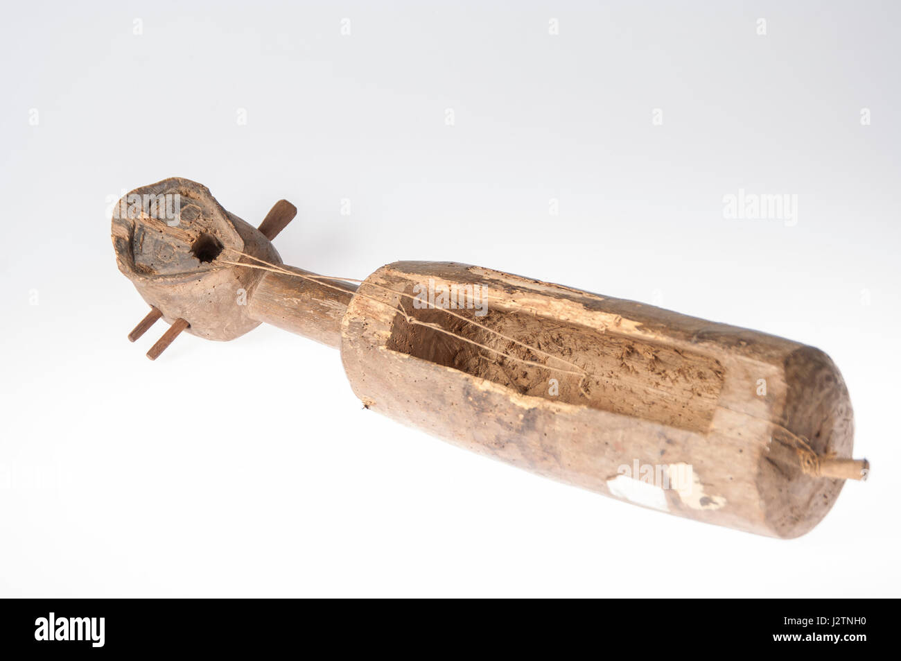 African music instrument with a face, made wooden, isolated on white ...
