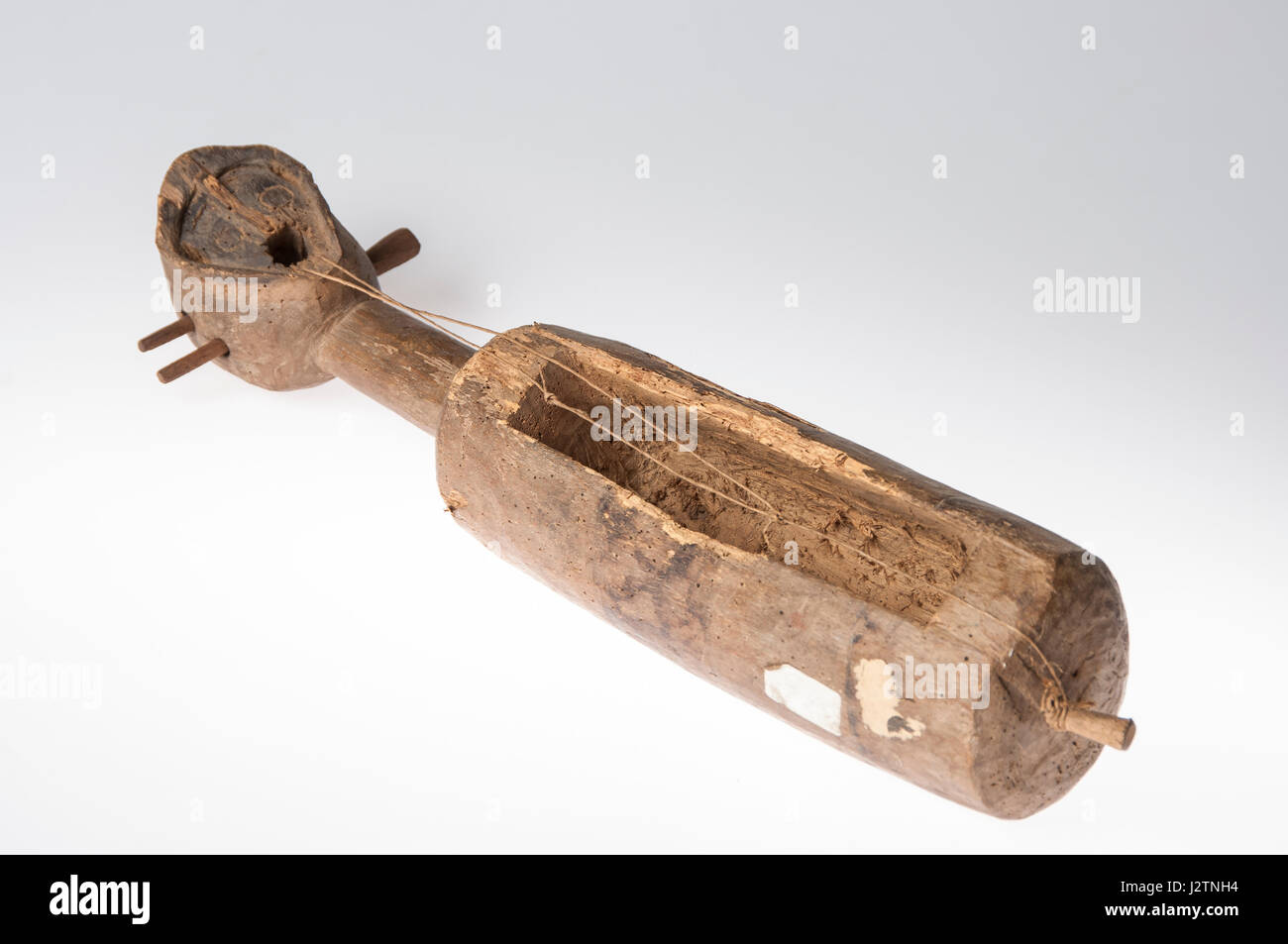 African music instrument with a face, made wooden, isolated on white ...