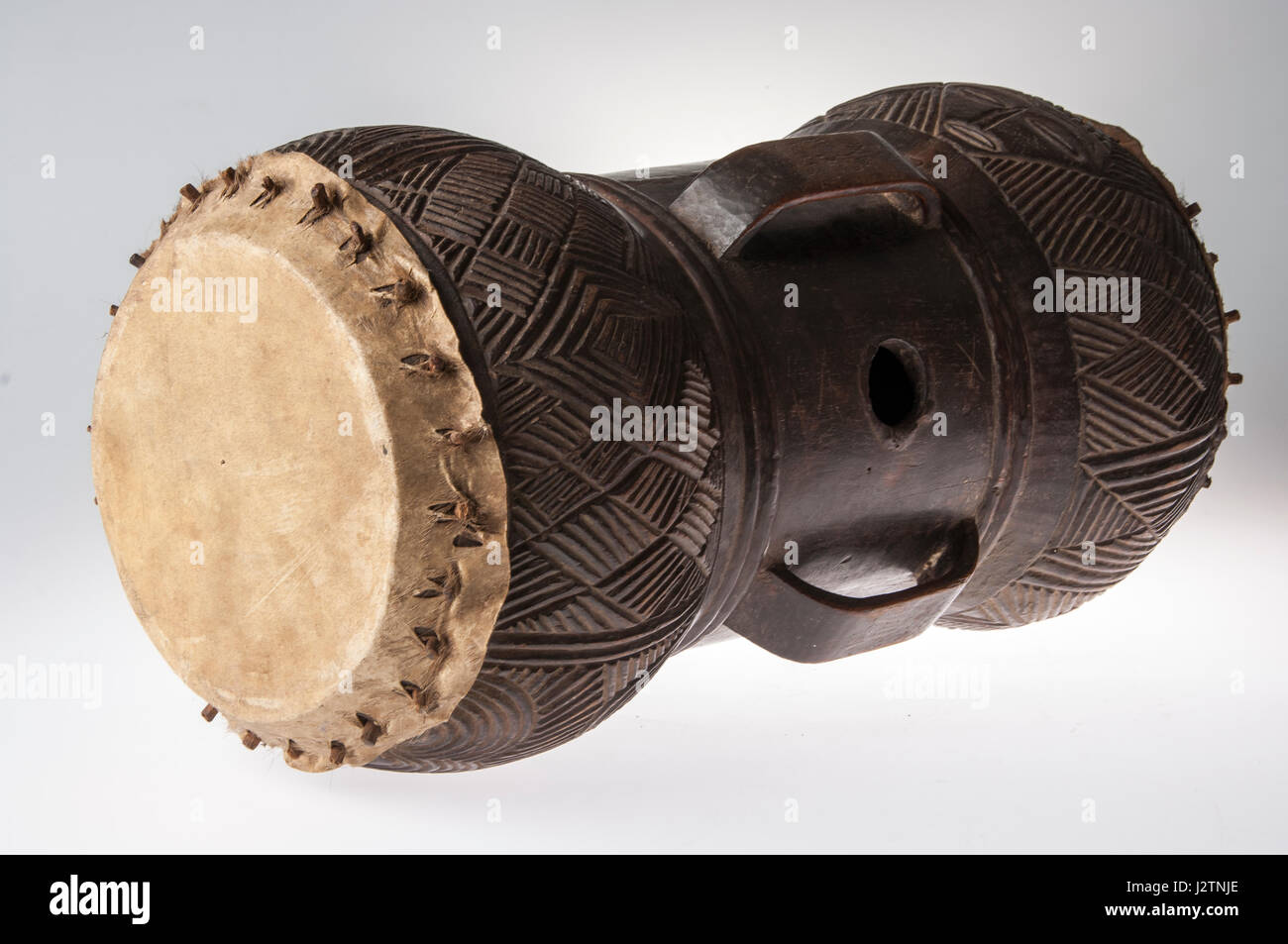 African music instrument, drum made of wood, isolated on white ...