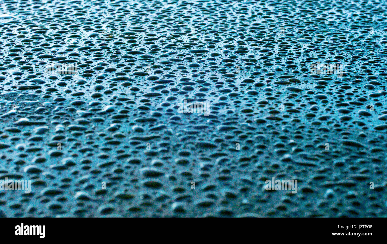 raindrops on the surface of water with graduated shade of shadow Stock ...