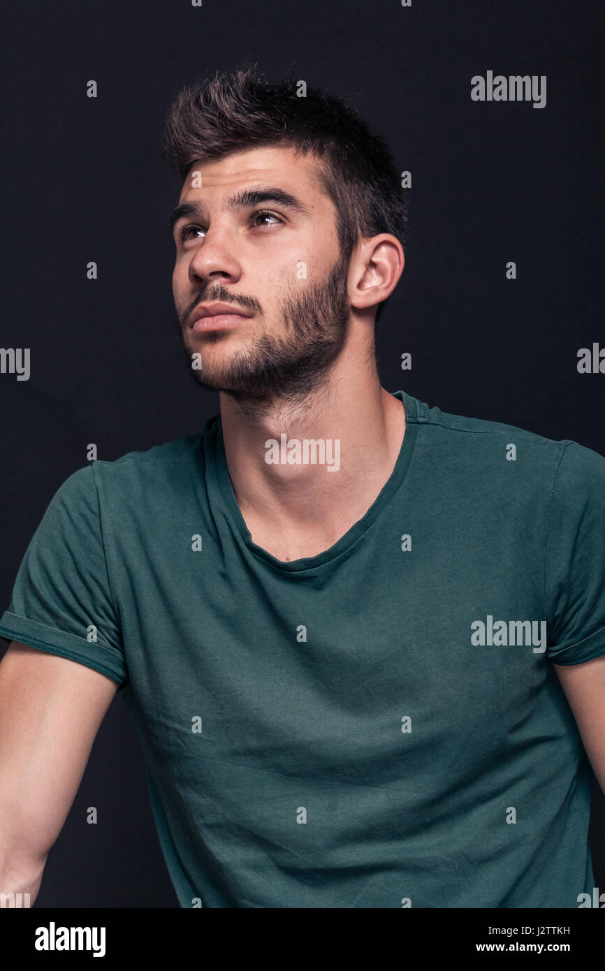 handsome man portrait, head face closeup, looking up above, black ...