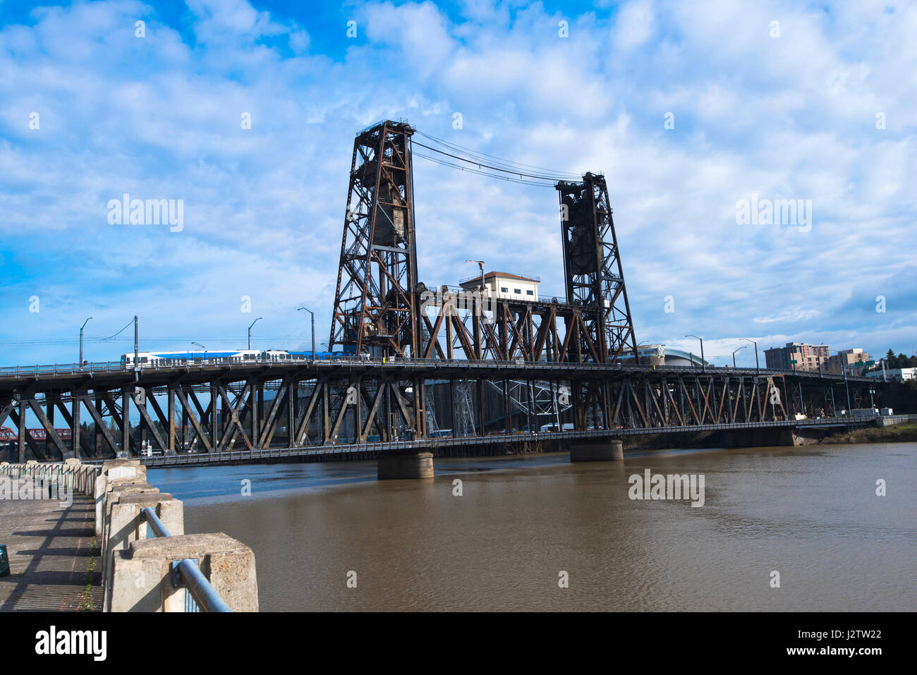 Old bridge from iron truss section with climbing towers and for the ...