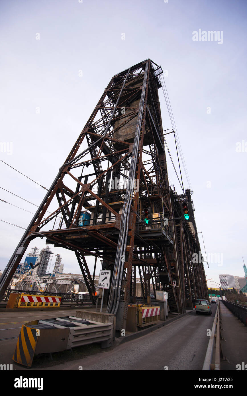 Rusty old truss bridge over the Willamette river hoist towers ...