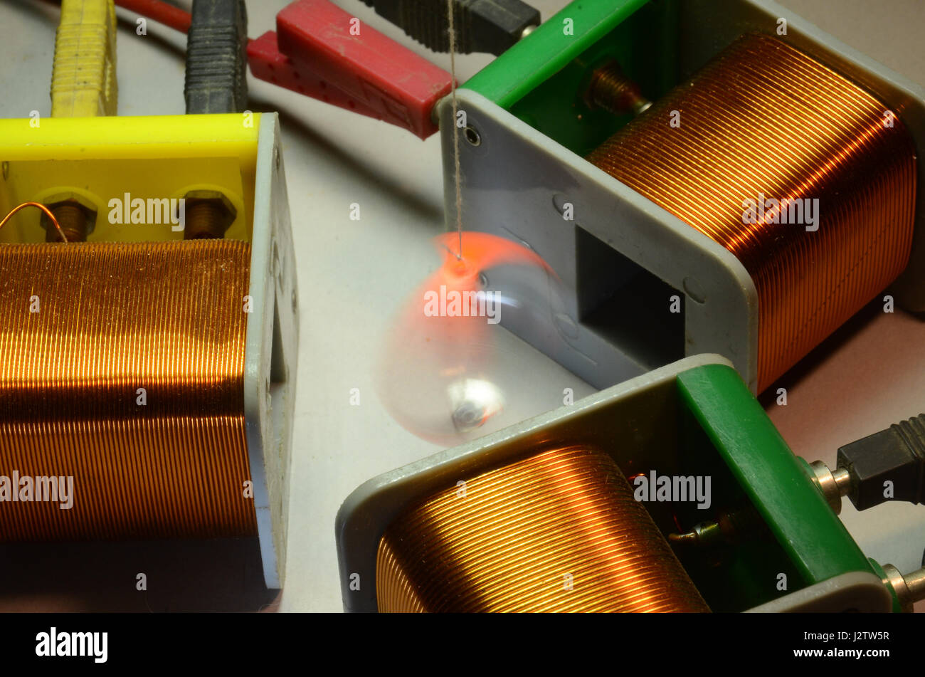 Demonstration of how a three-phase asynchronous motor works. The orange ...