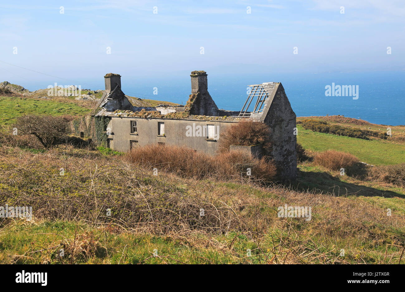 Abandoned ruined farmhouse building on west coast of Cape Clear Island ...