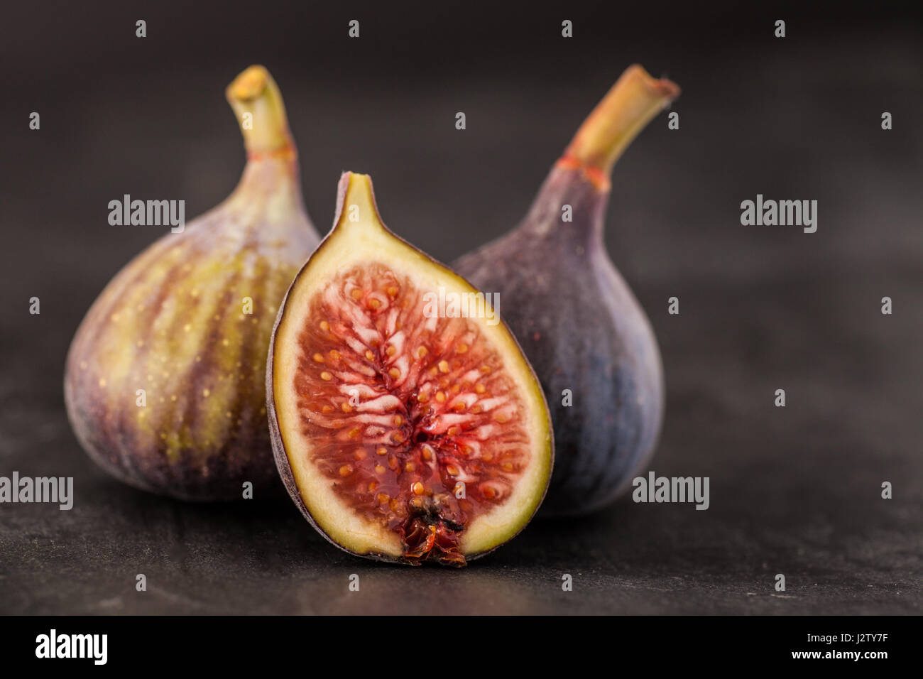Figs on a grey slate Stock Photo - Alamy