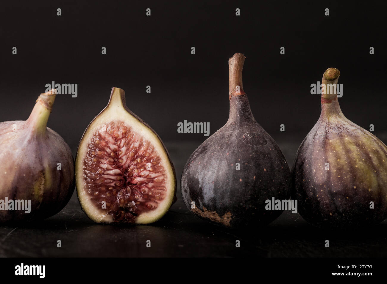 Figs on a grey slate Stock Photo - Alamy
