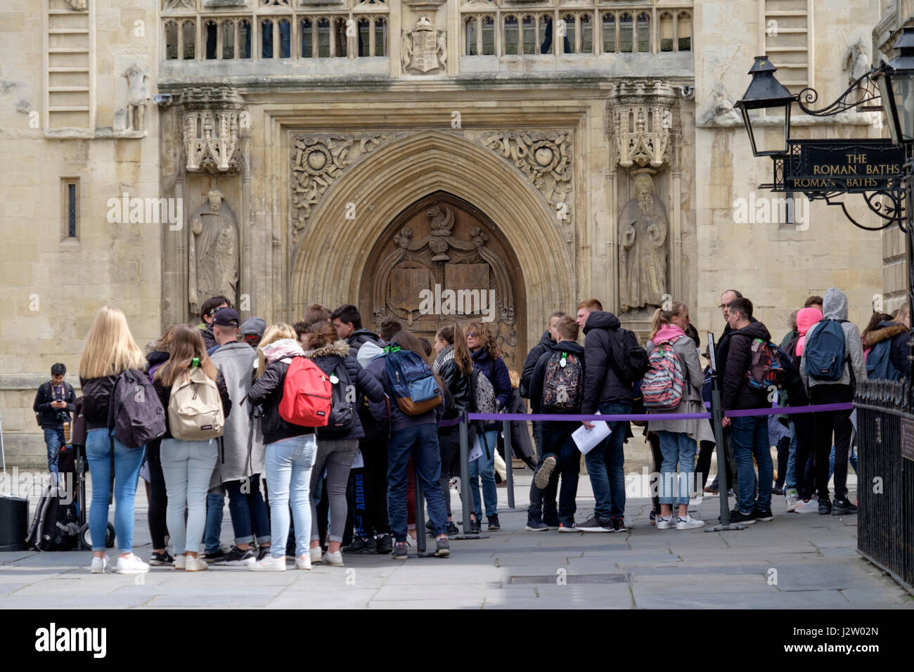 Tourists in Bath abbey courtyard england UK Stock Photo - Alamy