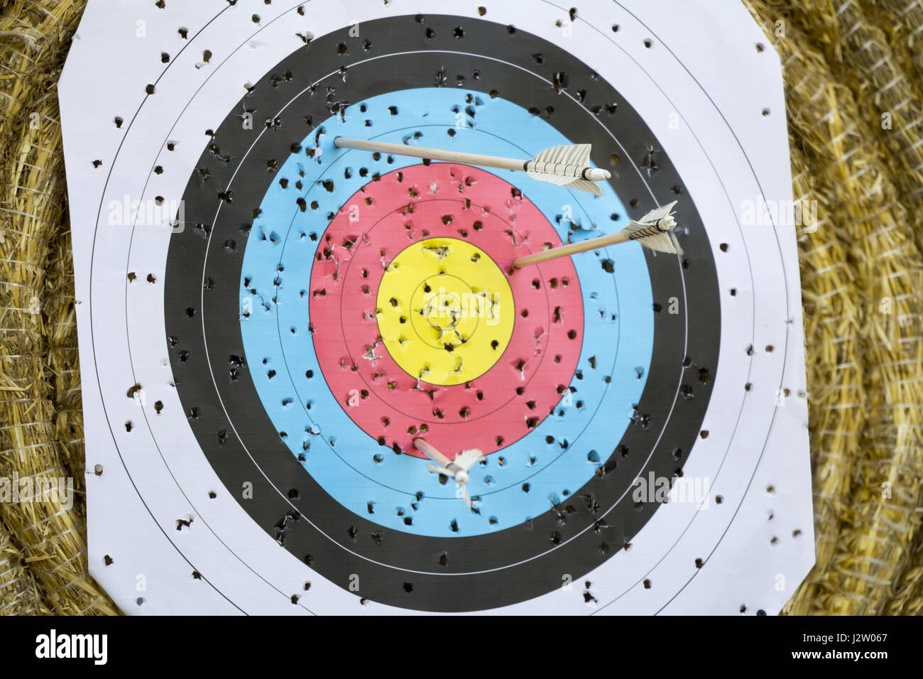 Archery Target With Arrows On a straw background Stock Photo - Alamy