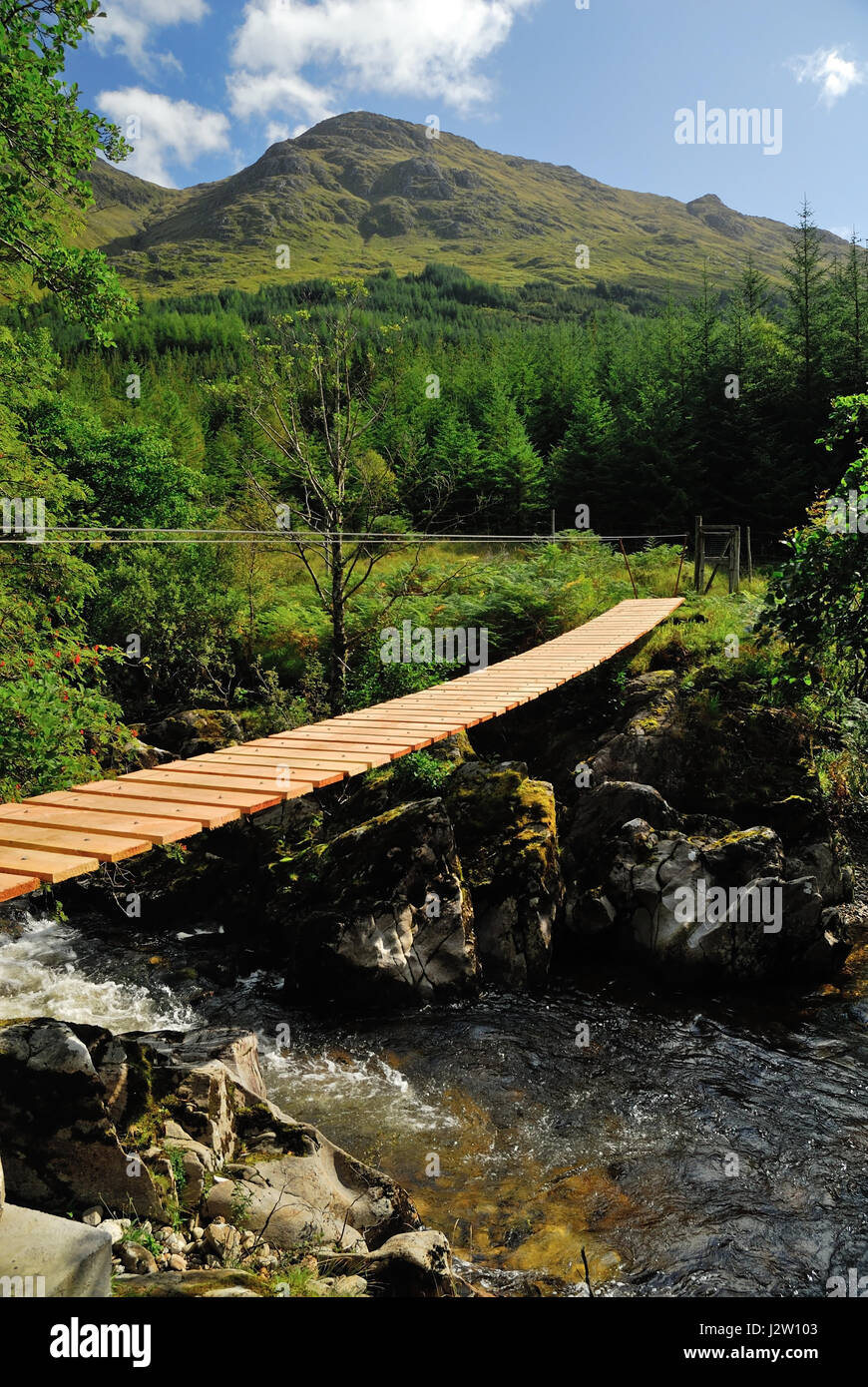A plank bridge over the river Finnan in Glen Finnan Stock Photo - Alamy
