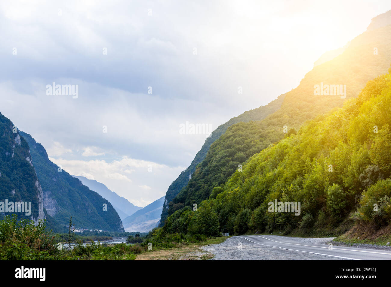 Cinematic road landscape. Asphalt Road throuth the mountains. With ...