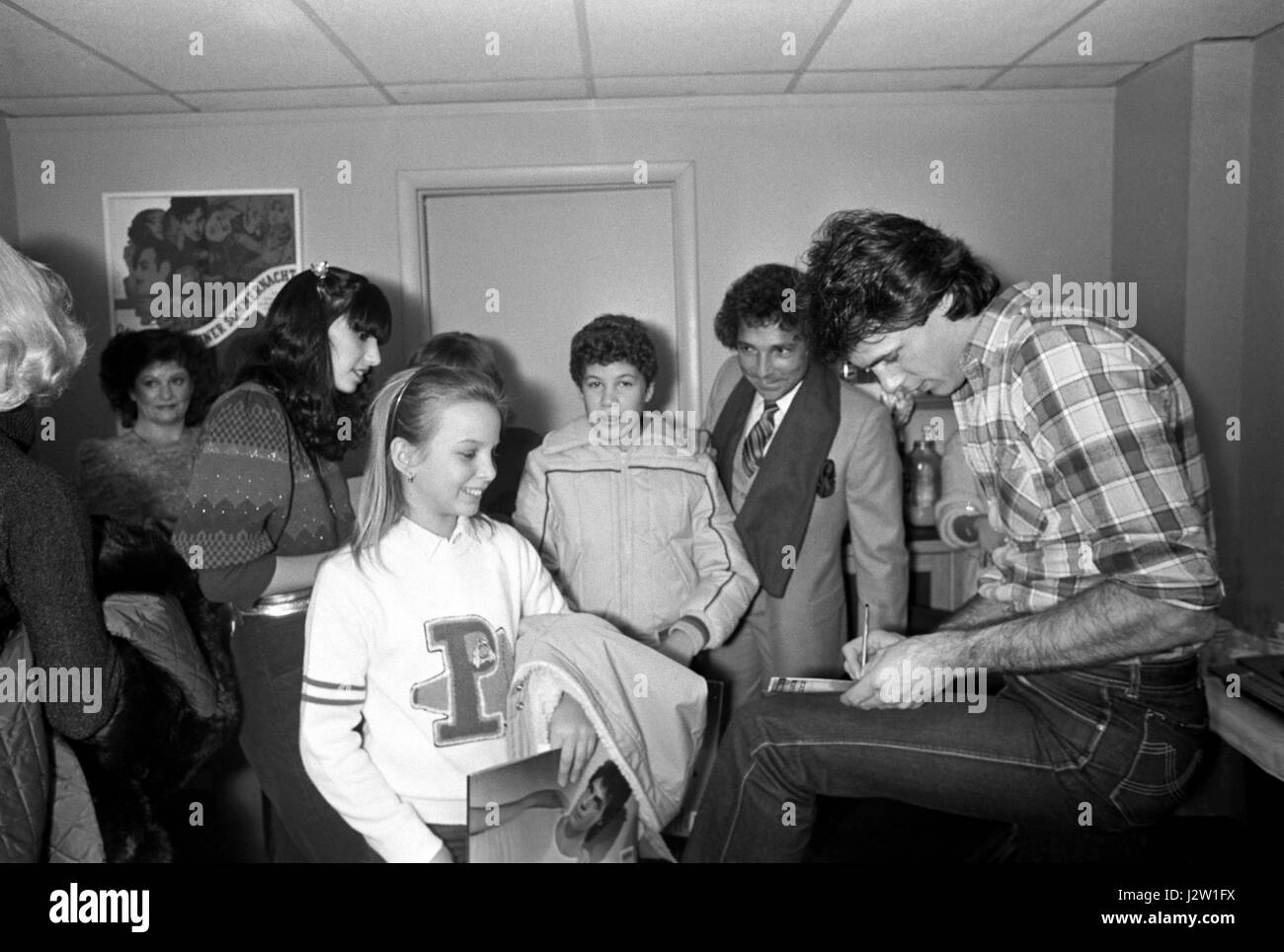 Rick Springfield signing autographs for fans before a gig at the ...
