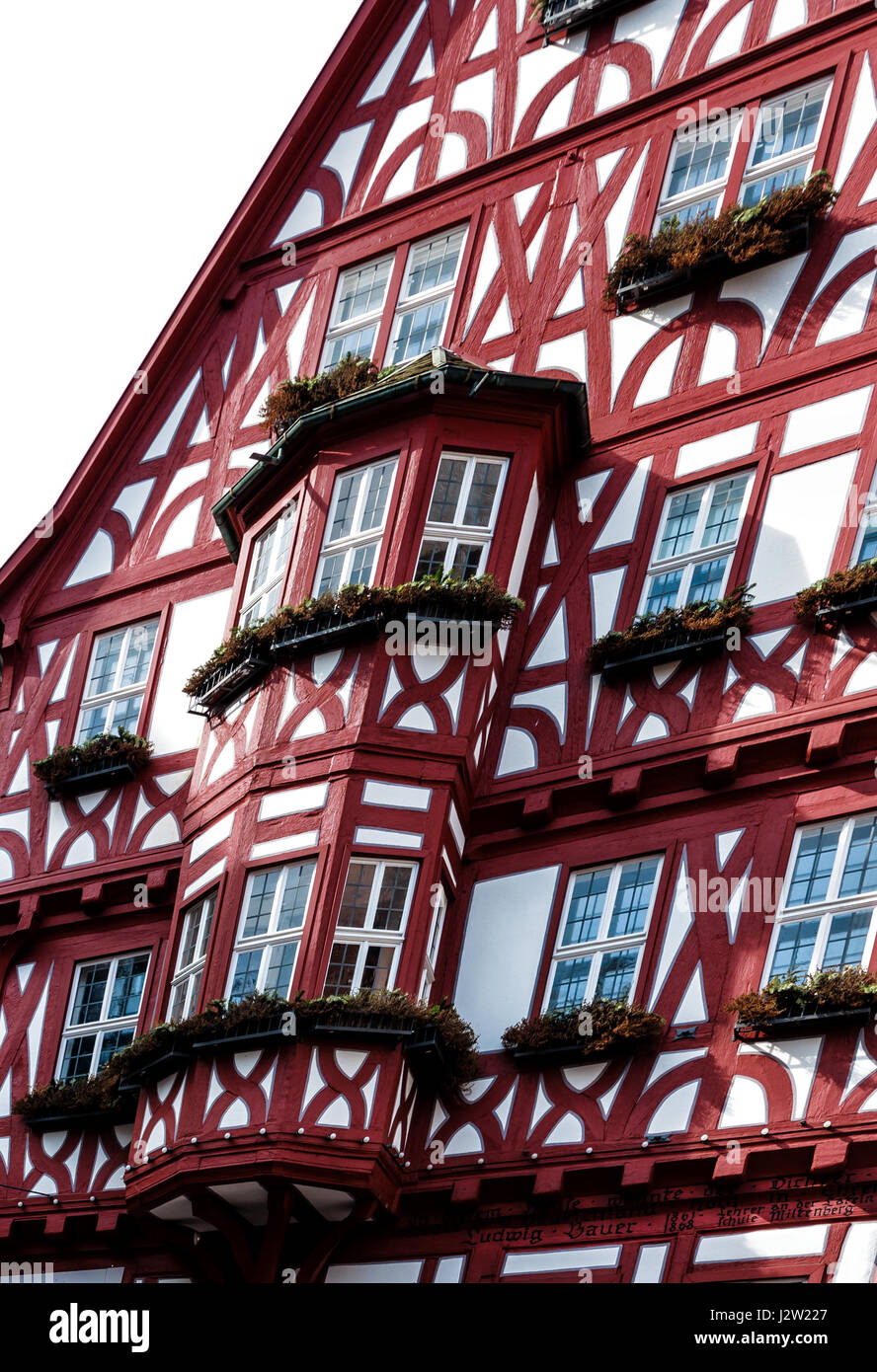 Picturesque historic half-timbered house with bay windows in the ...