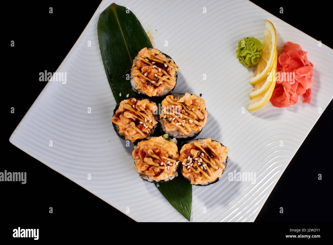 Baked Sushi Roll with crab, eel fish and spicy salmon Stock Photo - Alamy