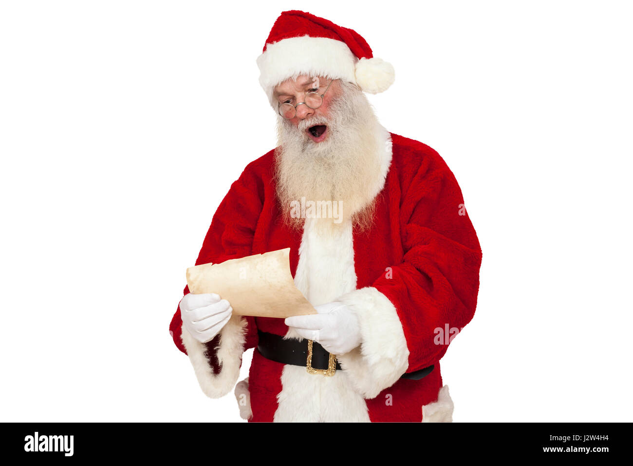 Santa Claus looking amazed on his wish list (isolated Stock Photo - Alamy