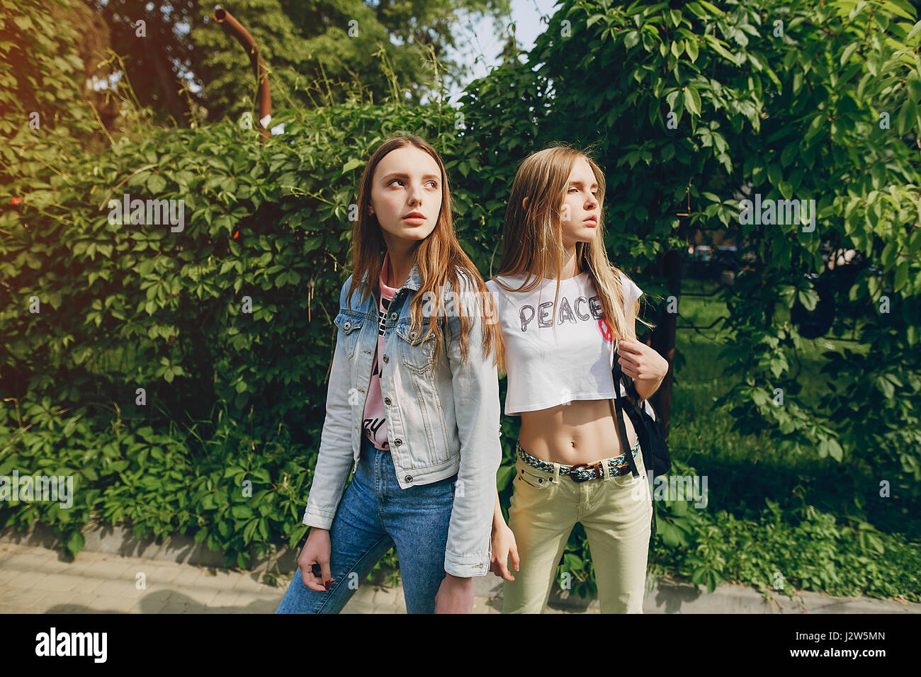 beautiful models pose for a photo in trendy clothes Stock Photo - Alamy