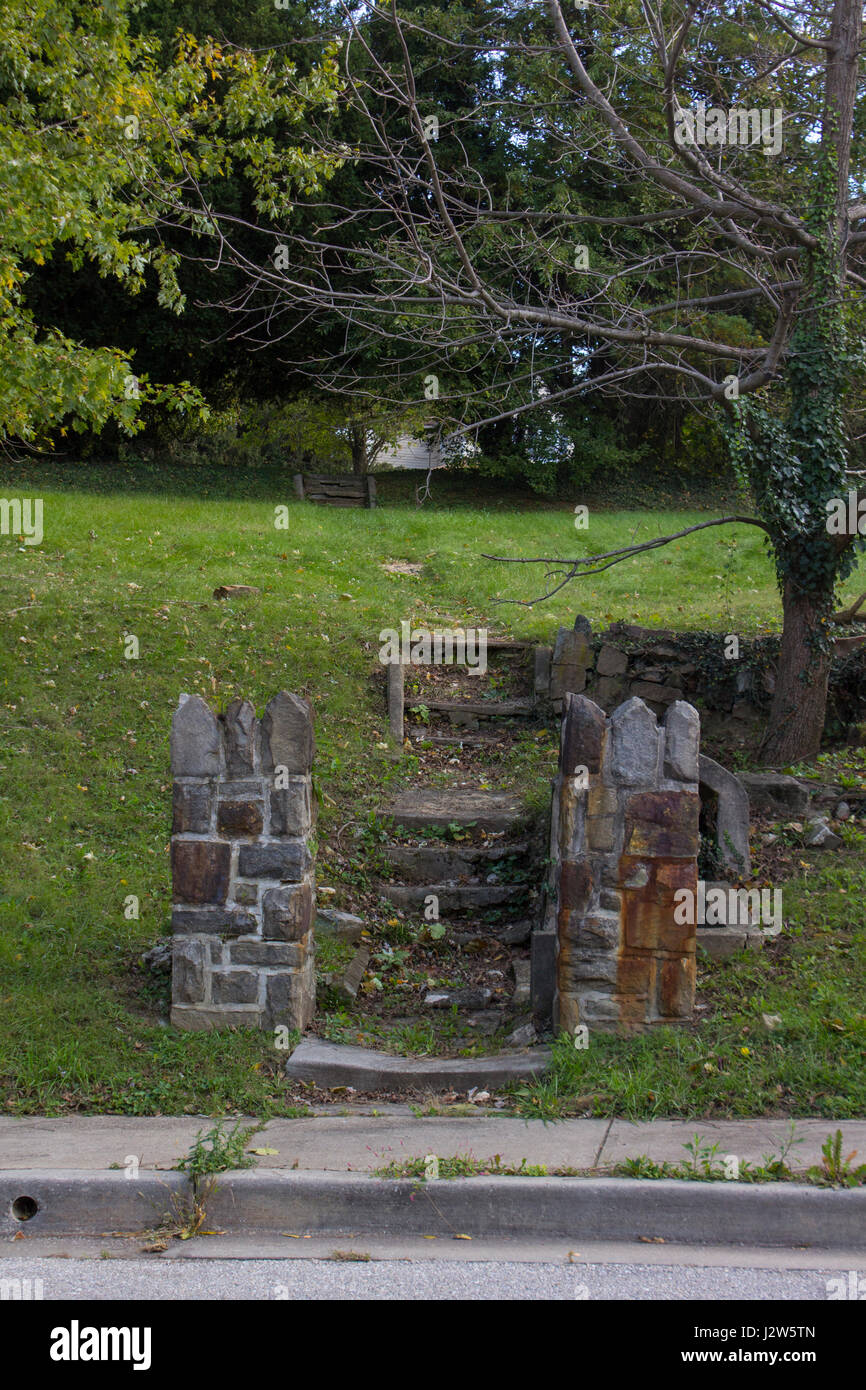 Vacant lot with original steps and sidewalk memorial in Baltimore Stock ...