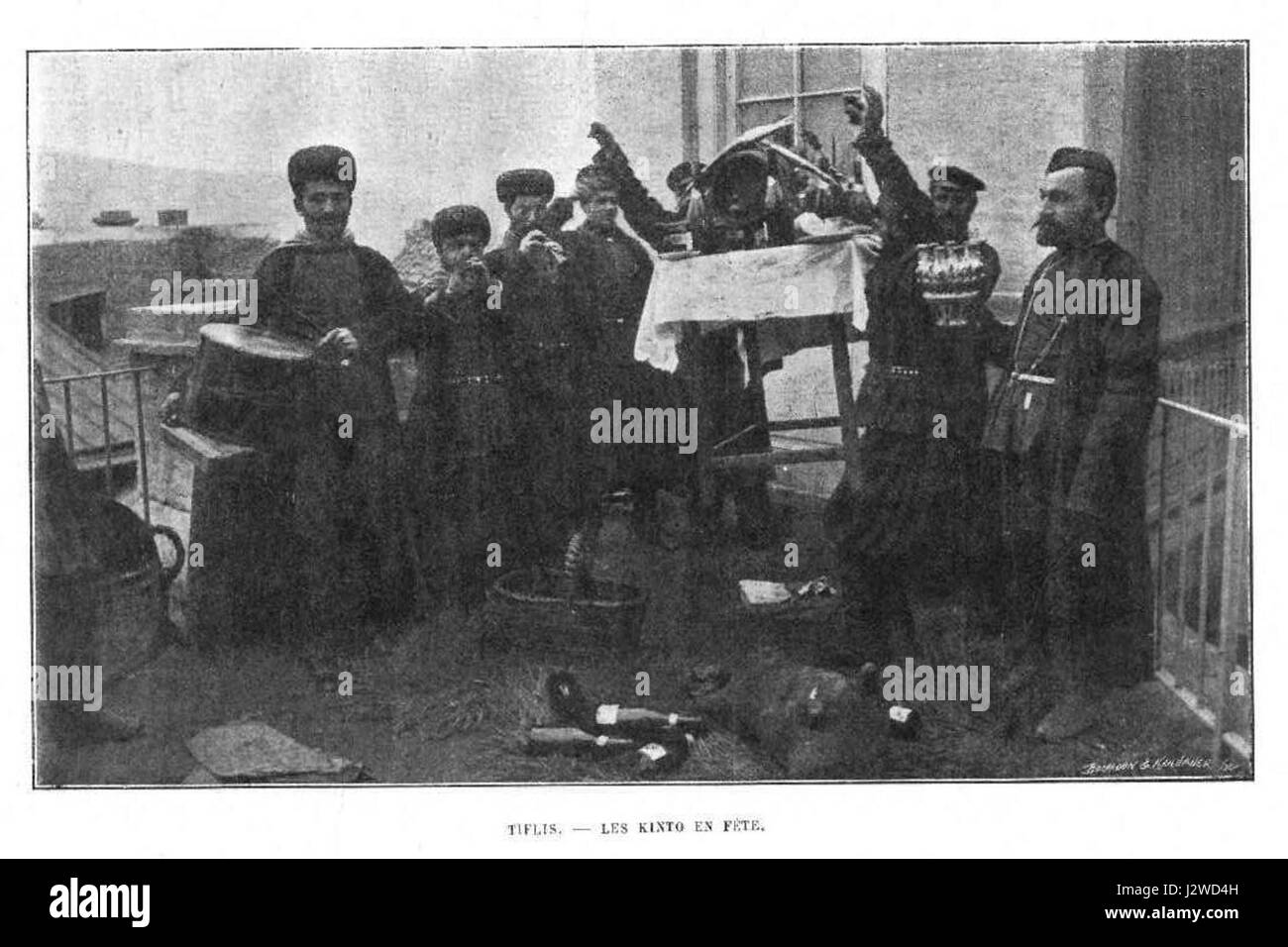 The image depicts a traditional feast of kintos in Tbilisi, Georgia ...