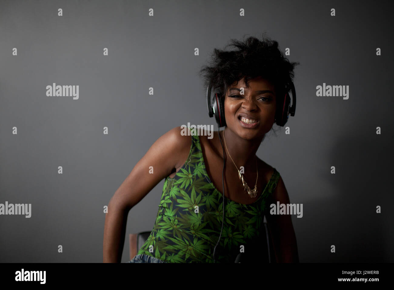 Young woman listening to music Stock Photo - Alamy
