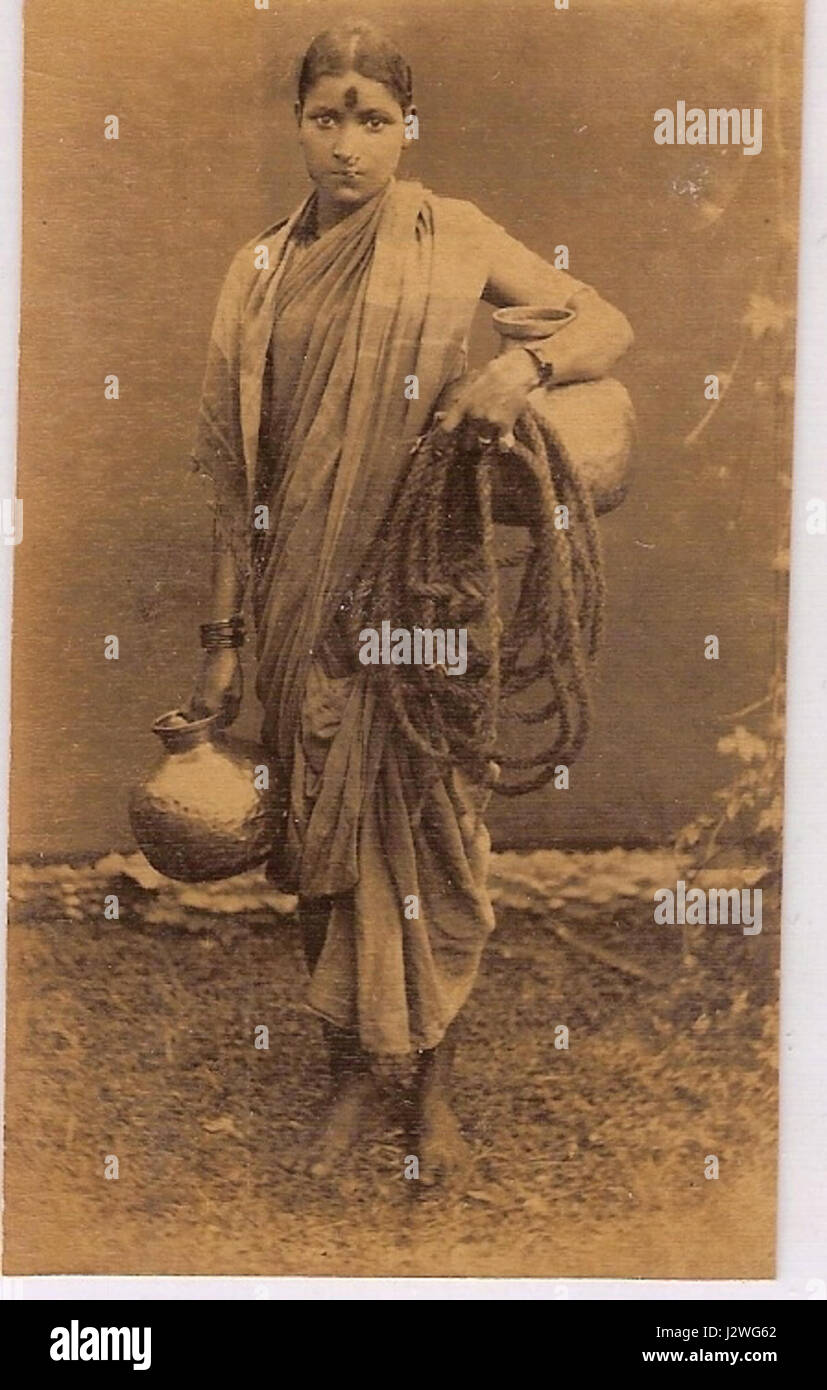 Woman drawing water in hi-res stock photography and images - Alamy